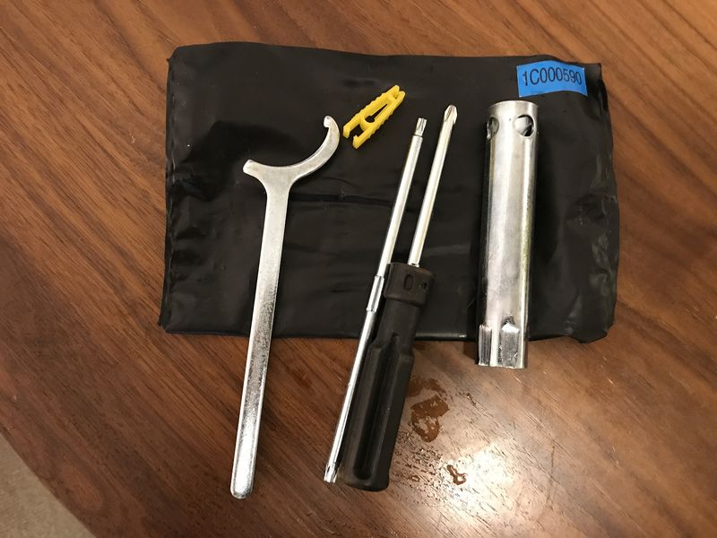 Modern Vespa : the tool kit that comes with the vespa (tied to under seat)?