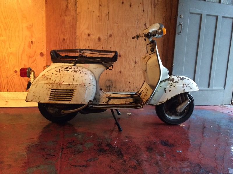Modern Vespa : Rally with rusted frame channel.