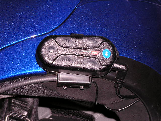 Modern Vespa : Bluetooth headsets and modular helmets.