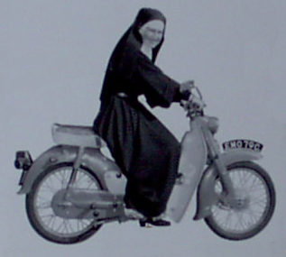 Modern Vespa : Can a Priest ride a 2 wheels vehicle in USA?