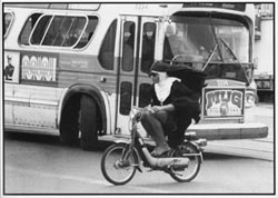 Modern Vespa : Can a Priest ride a 2 wheels vehicle in USA?