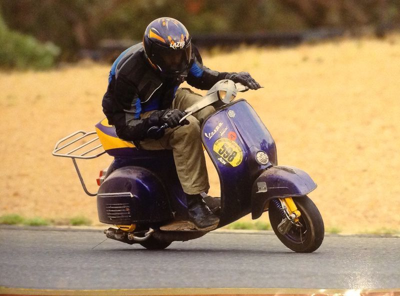 Modern Vespa : How to pull off a wheelie?