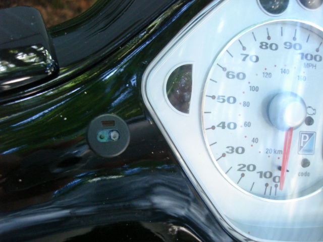 Modern Vespa : What is the button to the left of my speedometer?