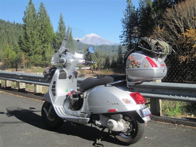 Modern Vespa : Riding two-up for a long distance.